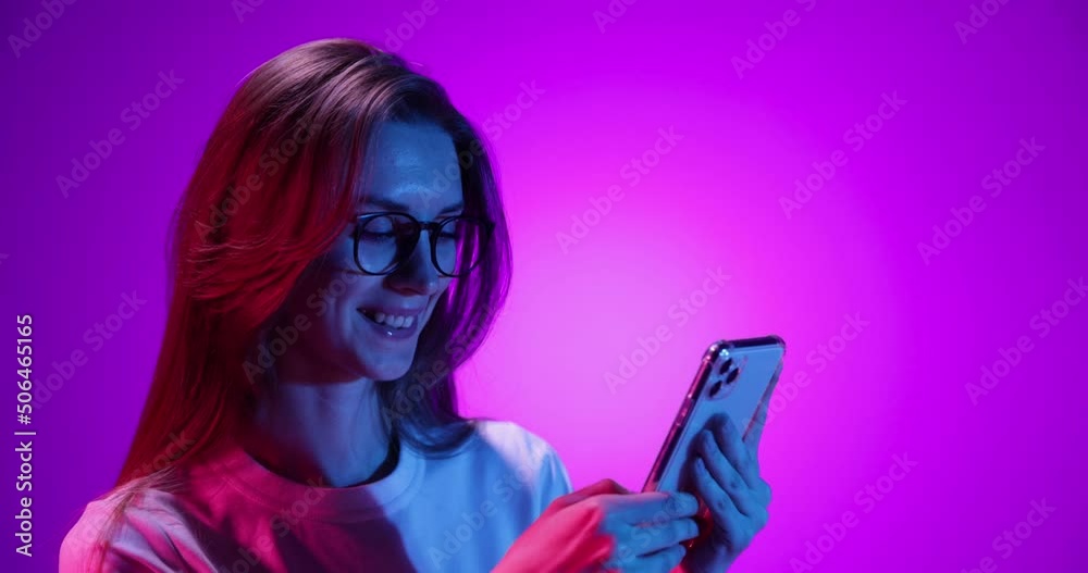 Beautiful young girl in eyewear using gadget, scrolling feed isolated ...