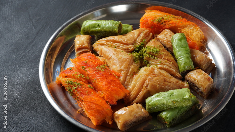 A tray of Turkish pastries including baklava, knafeh - a Middle Eastern ...