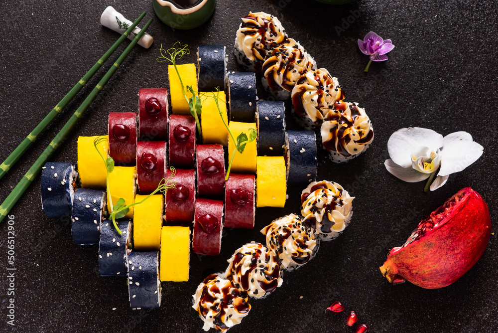 Rainbow Sushi set with salmon, eel, tuna, avocado, royal prawn, cream ...