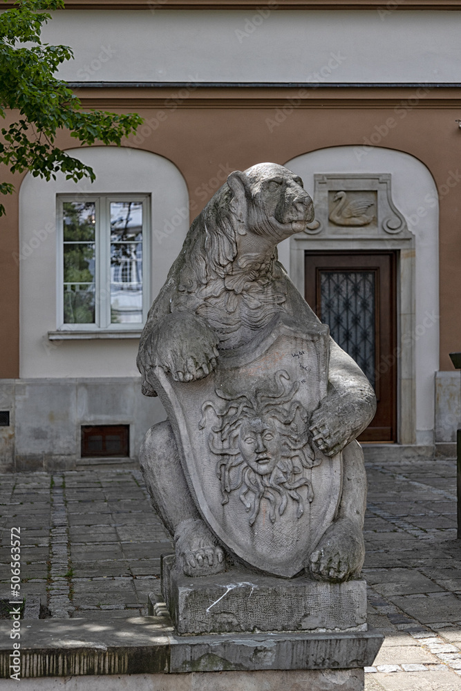WARSAW, POLAND - MAY 17, 2022: Statue of bear with shield with Gorgon ...