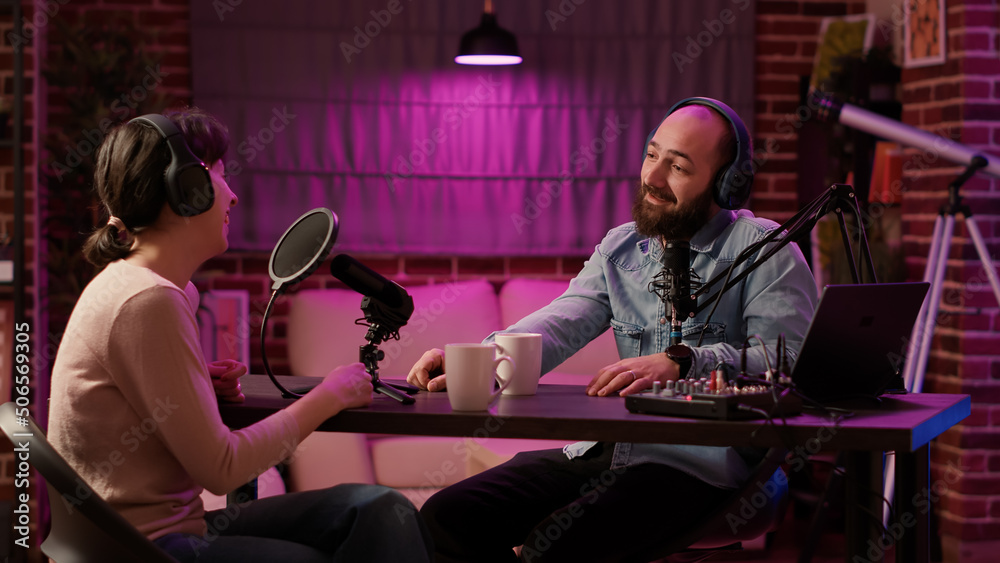 Man having casual conversation with woman in internet broadcast using ...