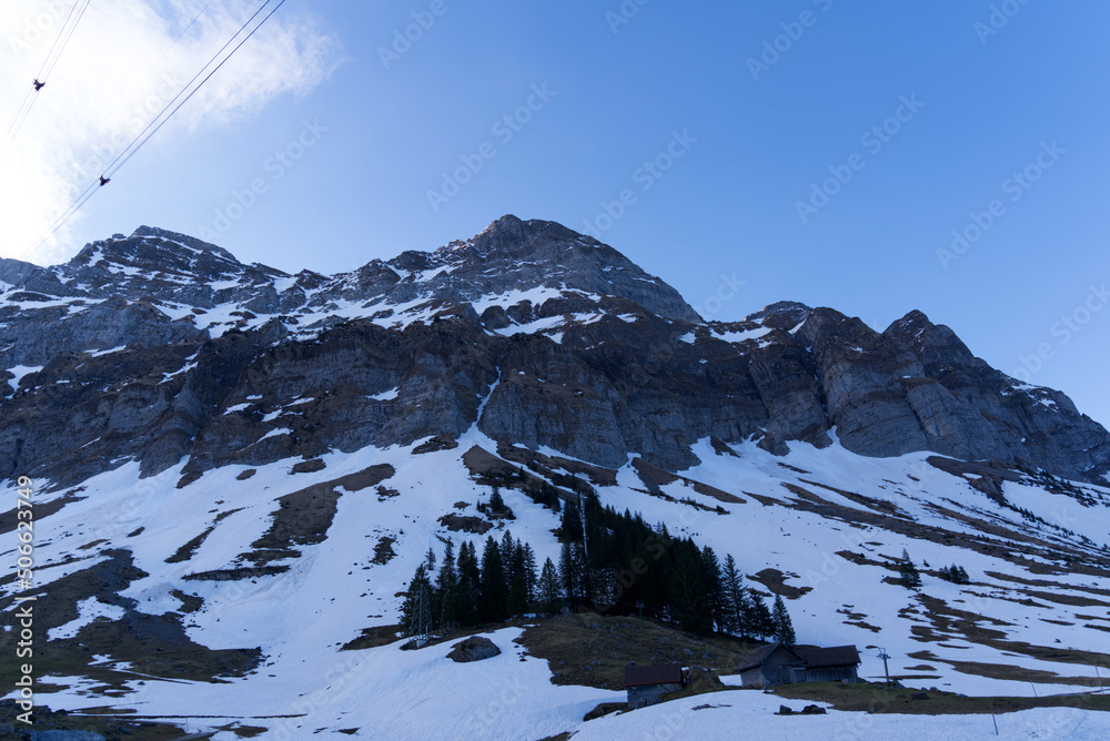 Alpstein mountains with peak Säntis and cable car cables on a blue ...
