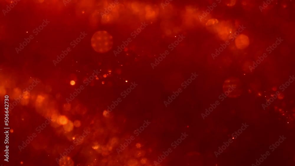 Abstract wavy movement of golden shiny particles in red. Dust Particles ...