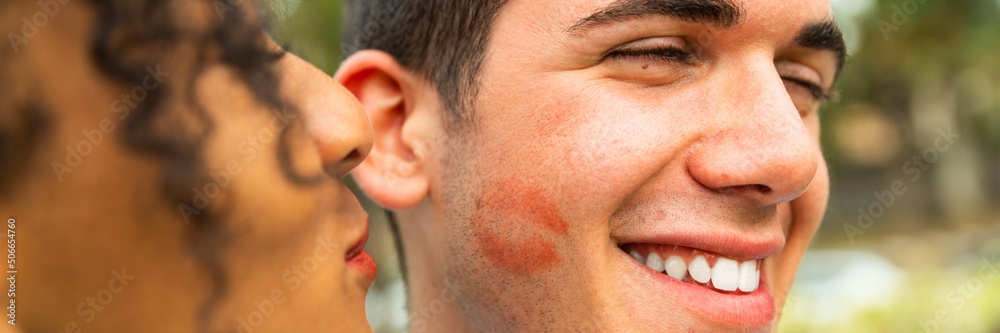 Multiethnic Young people kiss on cheek with lipstick – portrait of two ...