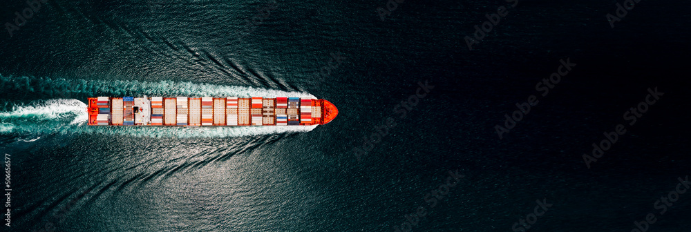 container ship sailing fulll speed to transport goods in containers for ...