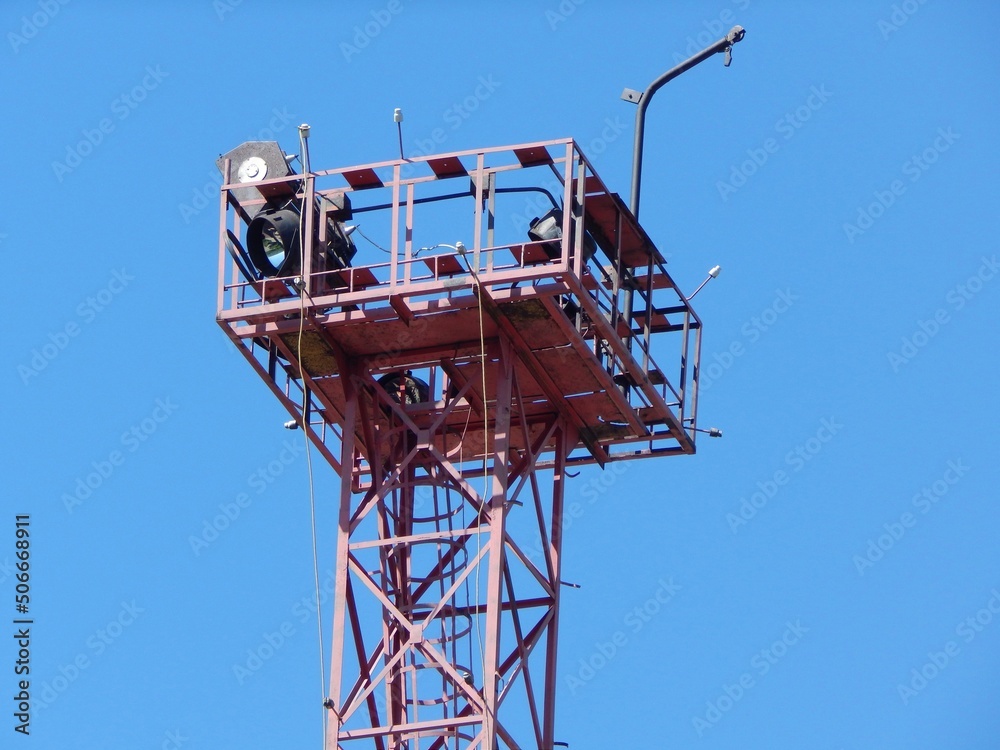 Lighting tower. Platform with spotlights on top of the metal tower ...