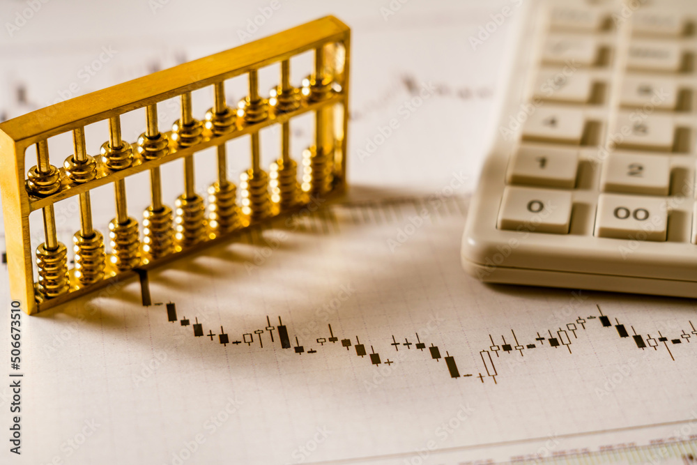 Abacus, calculator placed on candlestick chart - stock finance concept ...