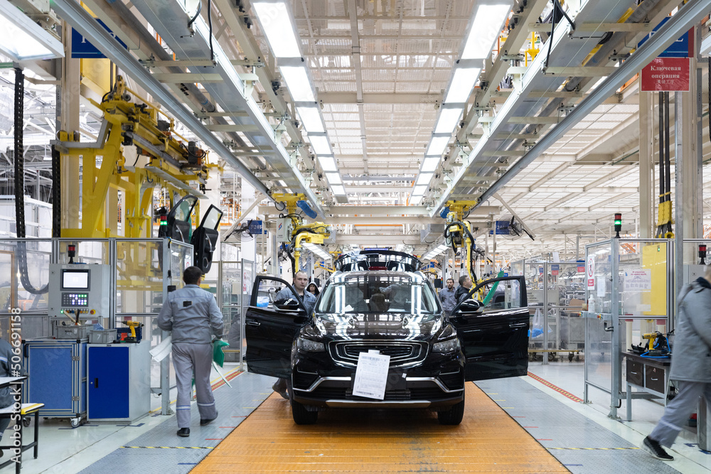 Car bodies are on assembly line. Factory for production of cars. Modern ...