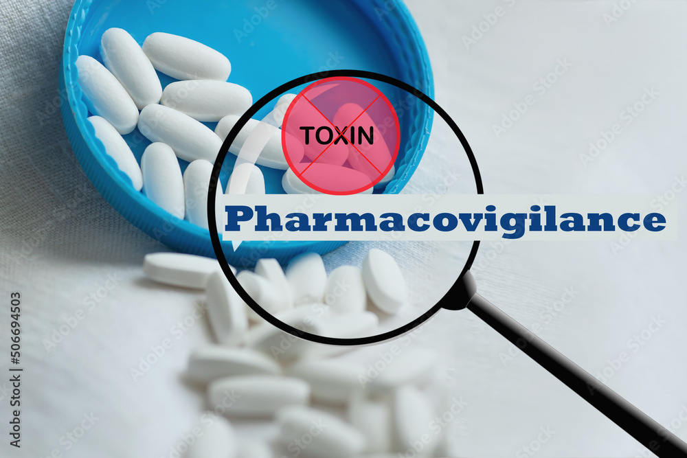 White pills close-up on a blue-white background with marked toxin, not ...