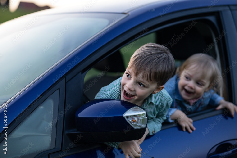 Two children are driving a car Stock Photo | Adobe Stock