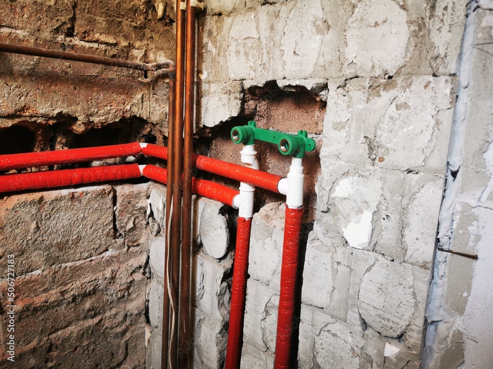 Polypropylene plumbing pipes in the wall. New construction of the ...