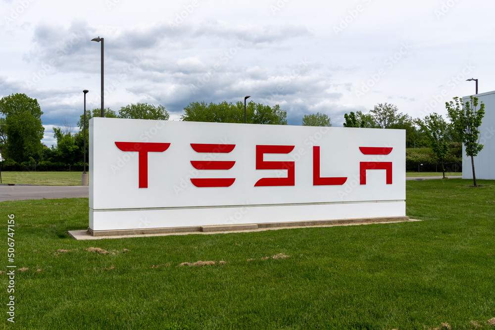 Buffalo, NY, USA - May 23, 2022: Closeup of Tesla ground sign is shown ...