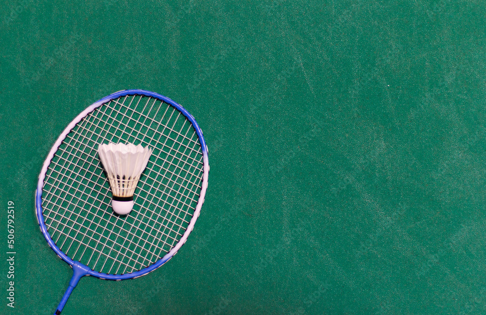 badminton balls and badminton rackets Shuttlecock in green badminton ...