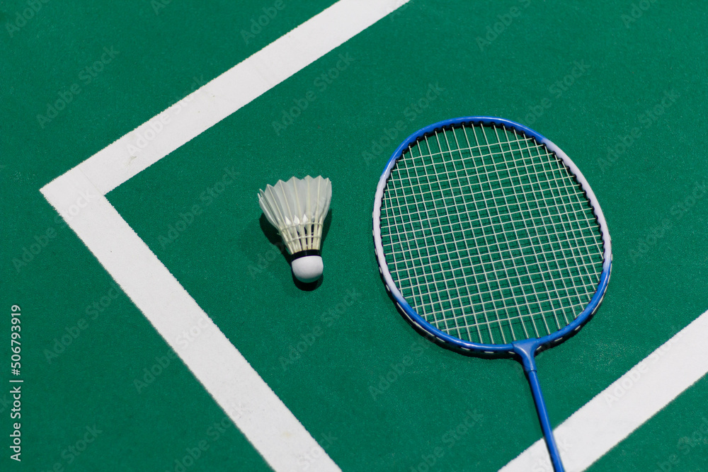 badminton balls and badminton rackets Shuttlecock in green badminton ...