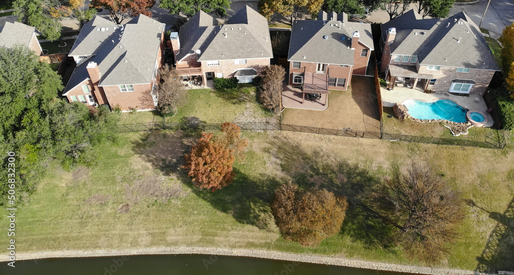 Poster Panorama aerial view riverside two story houses with metal fence ...
