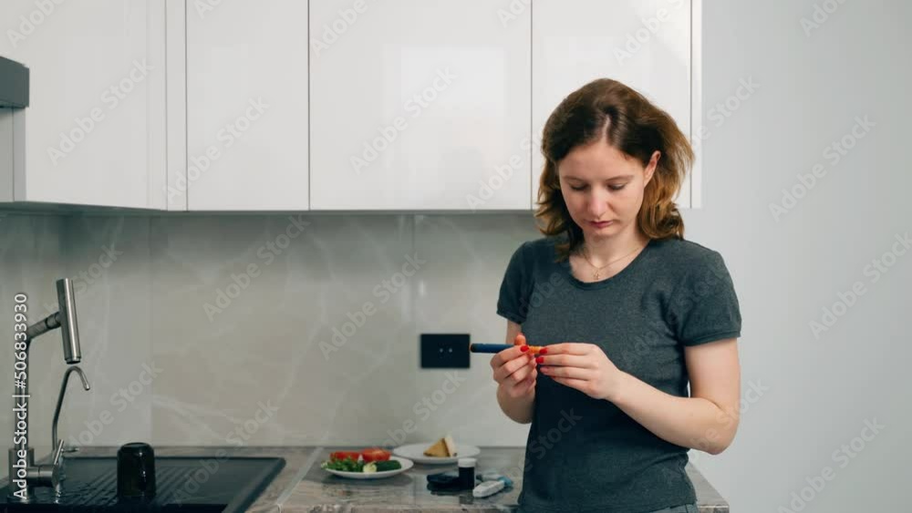 Woman diabetic giving insulin injection into shoulder using insulin pen ...