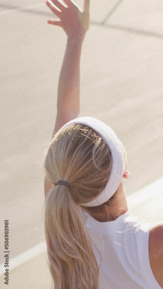 Video of back of caucasian female tennis player holding racket and ...