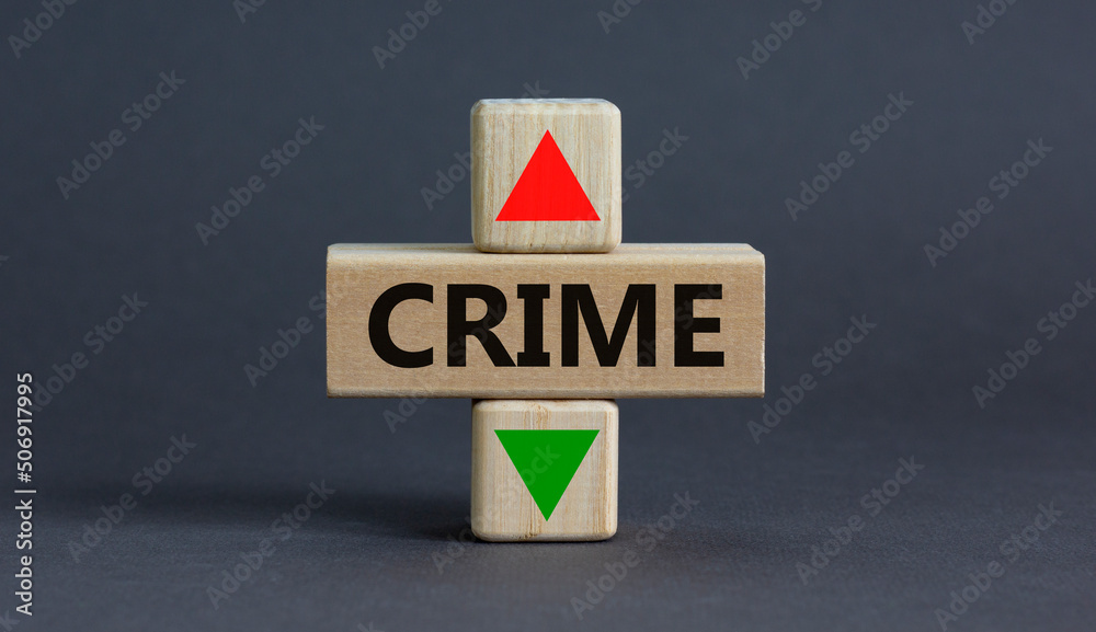 Crime rate symbol. A wooden cubes with up arrow. Wooden block with the ...