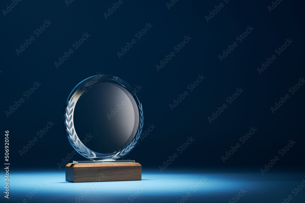 crystal trophy against blue background with copy space Stock Photo ...