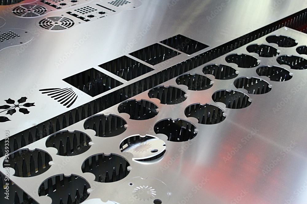 Steel plate with laser cuts of various semi products and components ...
