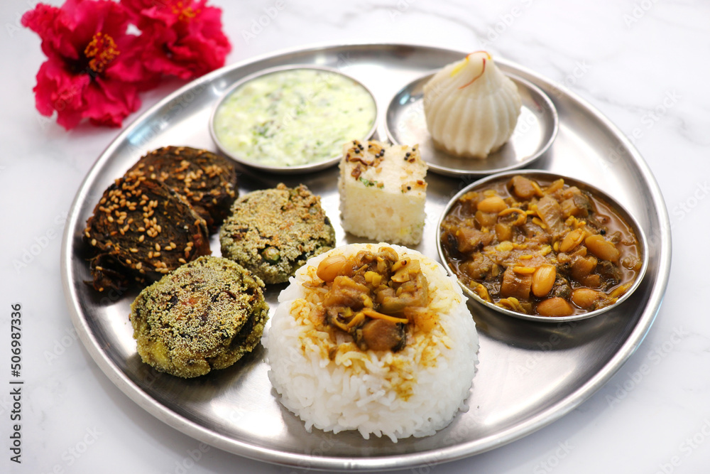 Indian vegetarian lunch or dinner Thali includes beans sabzi, dal rice ...