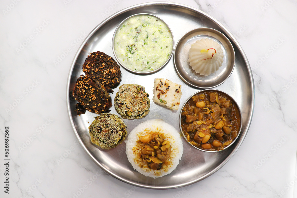 Indian vegetarian lunch or dinner Thali includes beans sabzi, dal rice ...