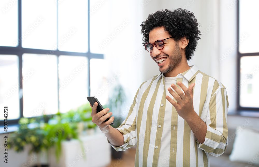 technology, communication and people concept - happy smiling young man ...