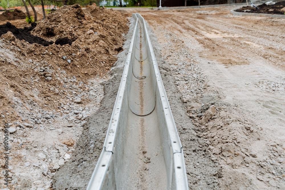 Drainage system for wastewater on the road. Construction of a canal for ...