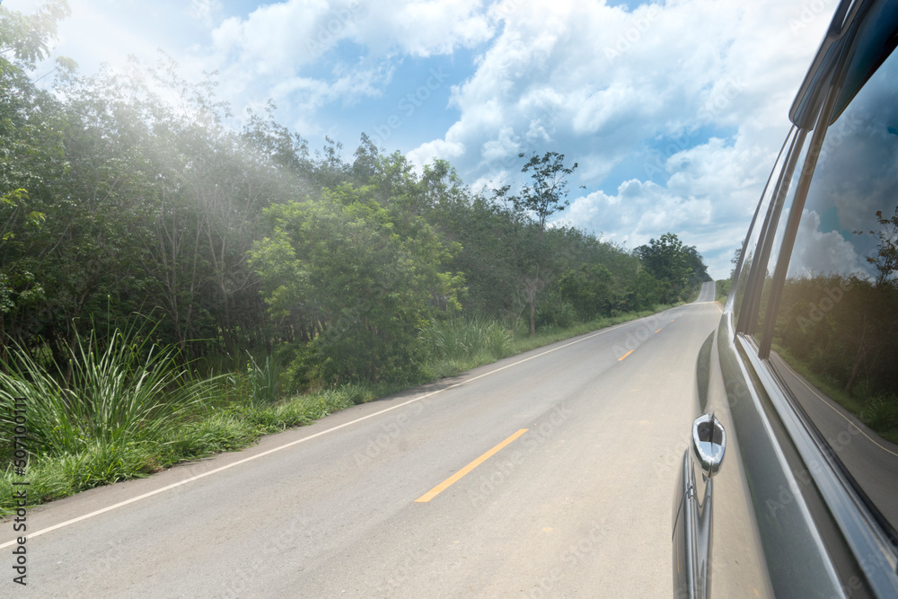 Beside car on the aphalt road. Car driving on asphalt road with green ...