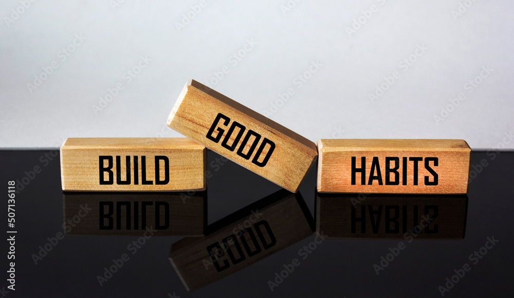 Symbol of good habits. Wooden blocks with the words Create good habits ...