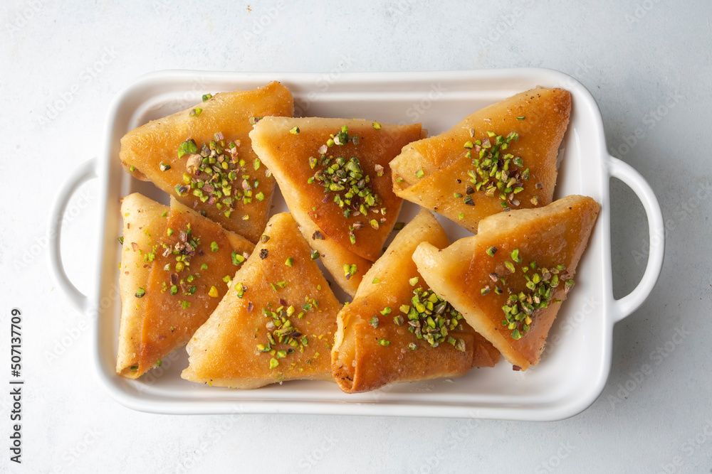 Traditional Turkish desserts; custard triangular dessert, albanian ...