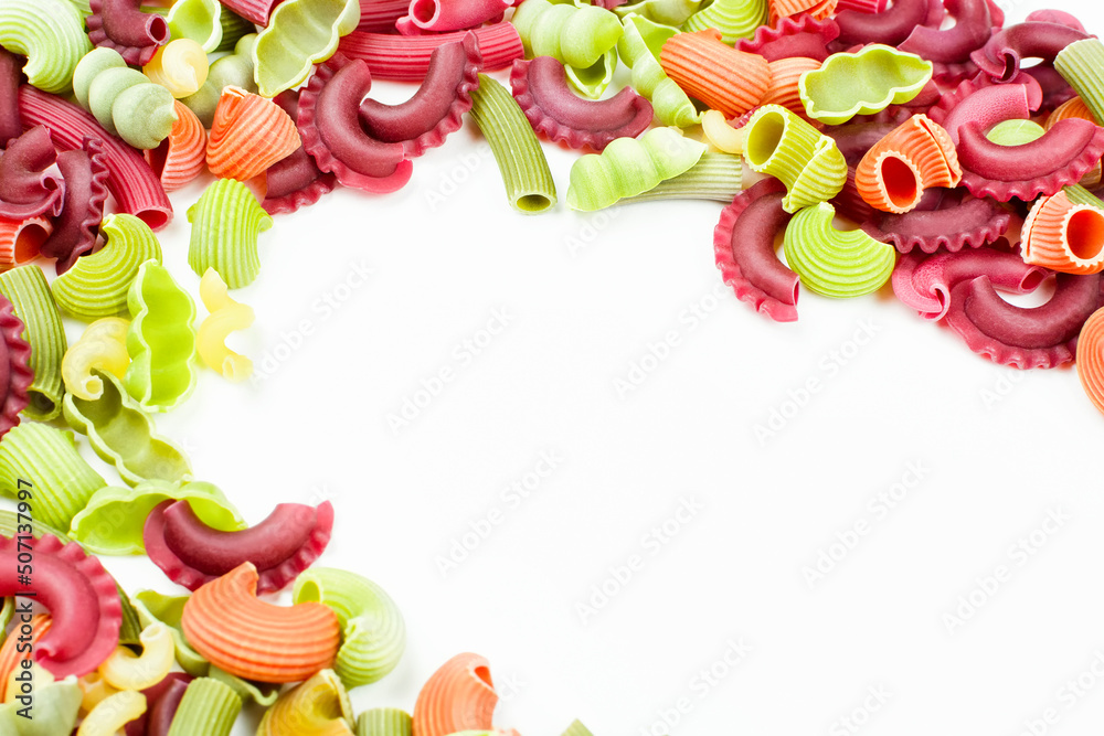 Frame of multicolored pasta of different shapes tortiglioni, gnocchi ...
