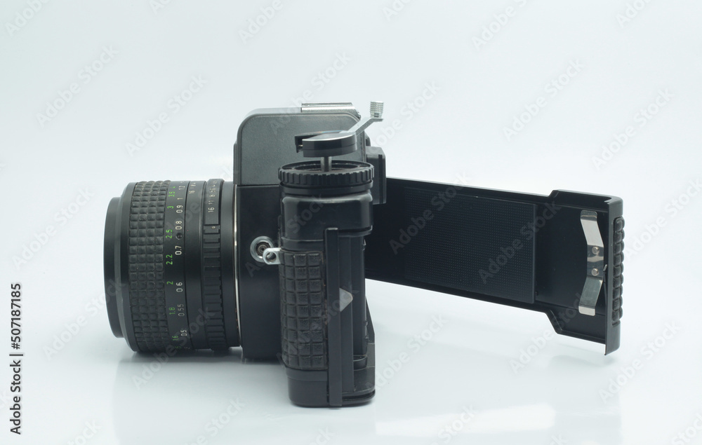 Vintage analog phtographic camera with chamber opened to insert the ...