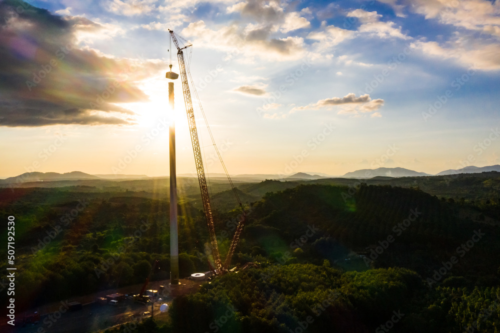 Installing of wind turbine tower with construction crane, Power plant ...