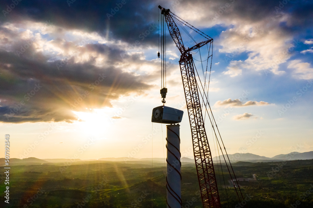 Installing of wind turbine tower with construction crane, Power plant ...