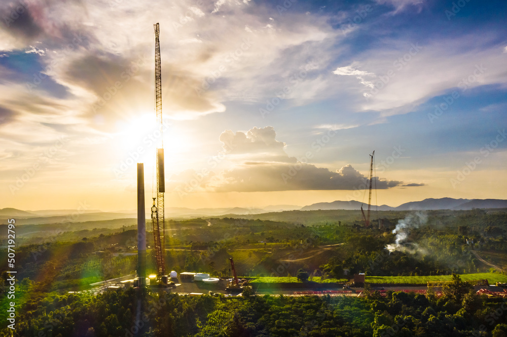 Installing of wind turbine tower with construction crane, Power plant ...