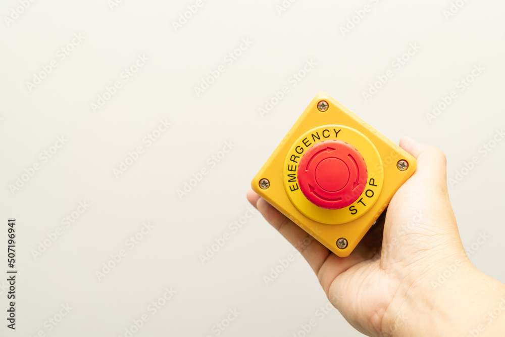 Stop Button and the Hand of Worker About to Press it. emergency stop ...