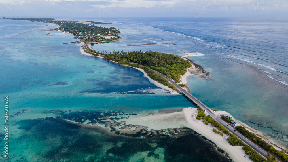 Aerial view of tropical beach landscape and local road at addu city ...