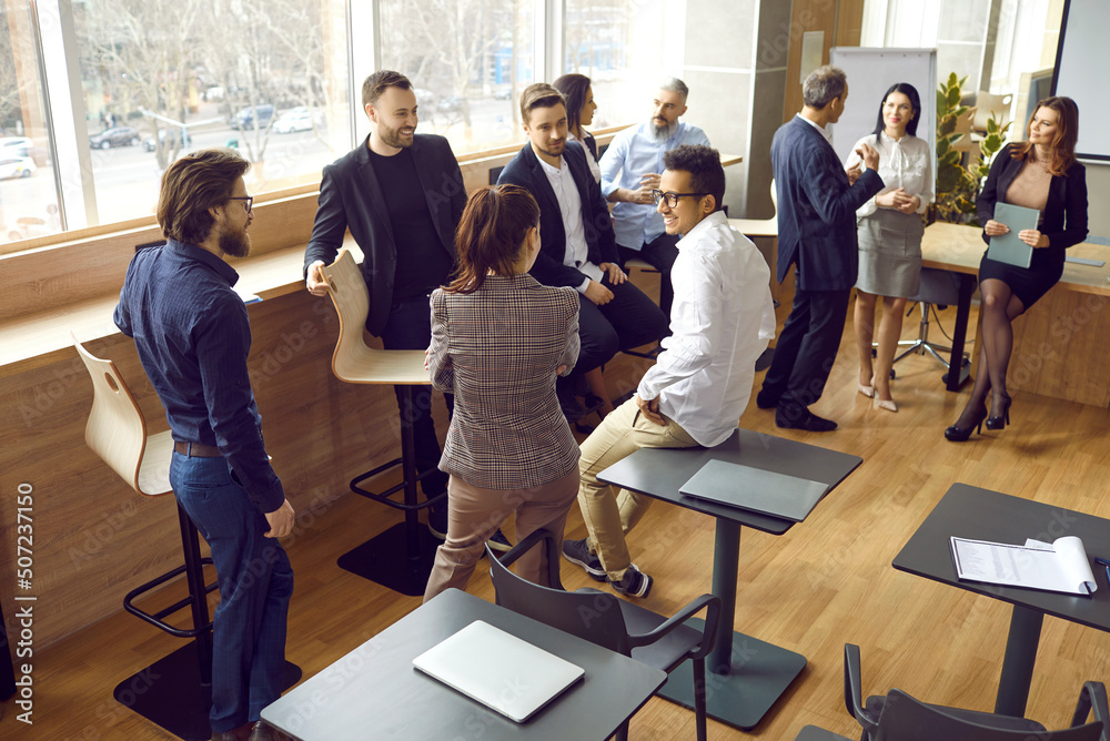 Nice talk. Friendly diverse employees or office workers communicating ...