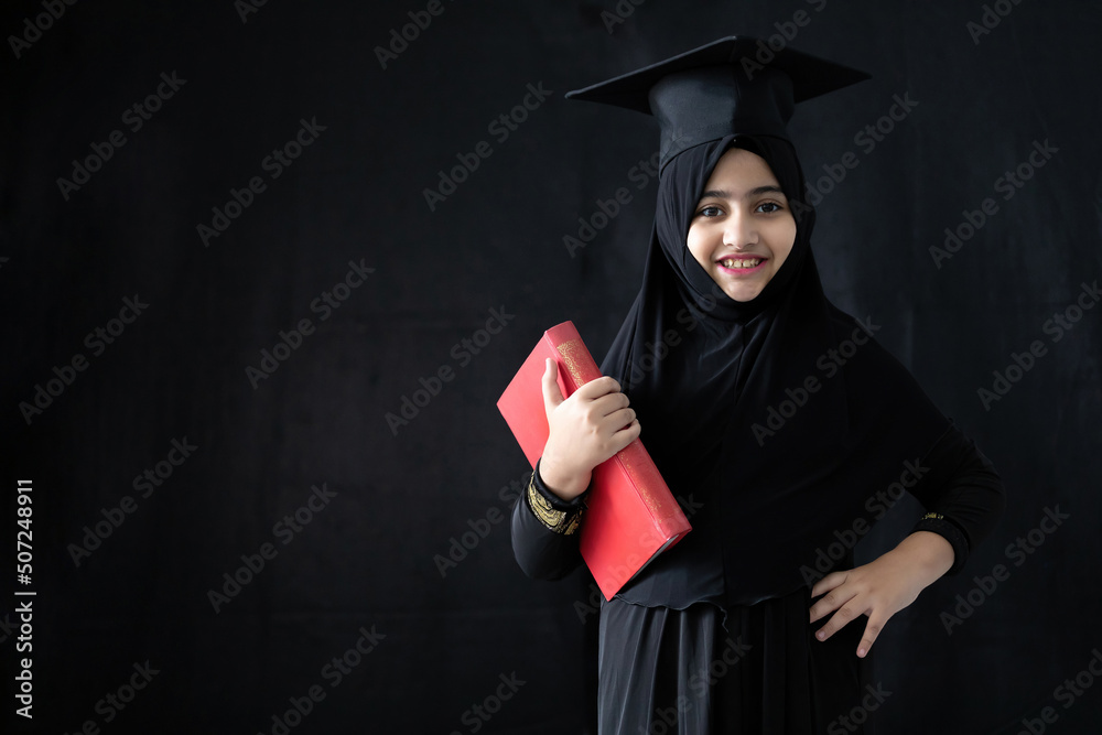muslim student girl with hijab wearing graduation cap and holding a ...