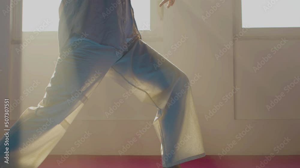 Man performing slow movements in gym. Unrecognisable Caucasian man ...