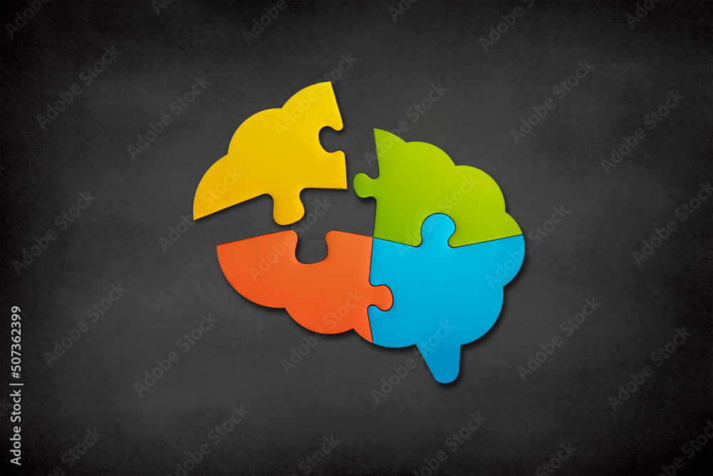 Brain shaped jigsaw puzzle on black background. Human mind complexity ...