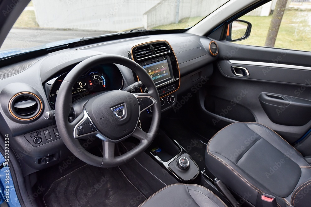 Dacia Spring. A small electric car in the city. Cabin interior ...