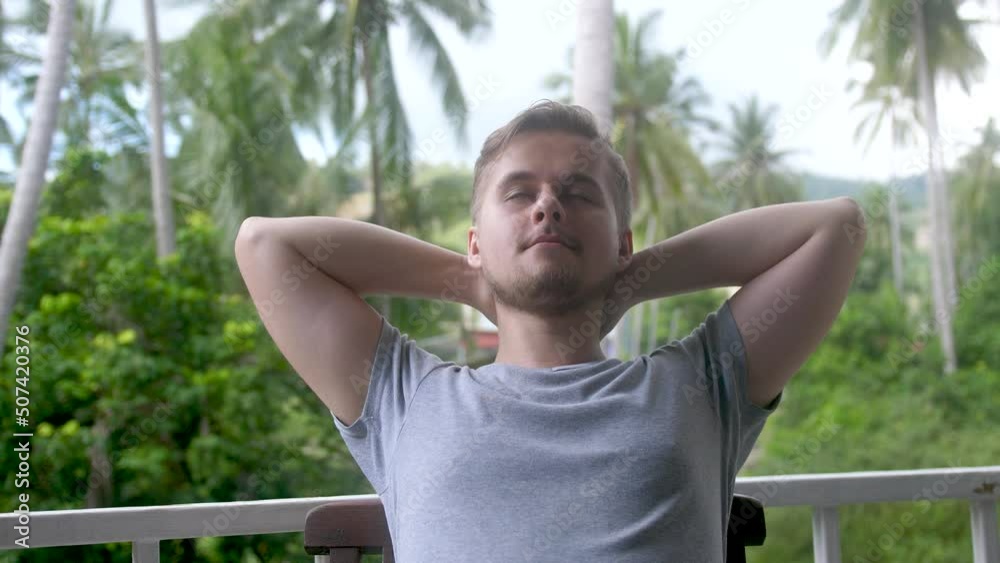 Calm guy relax lean in comfy chair closed eyes put hands behind head ...