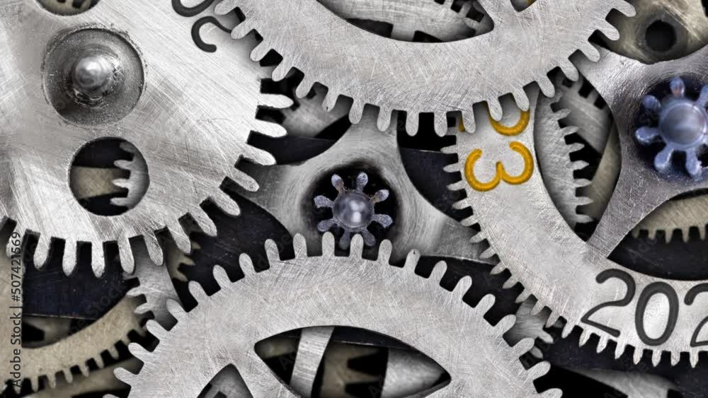 Rotating tooth wheel with New Year 2023 and group of wheels going from ...