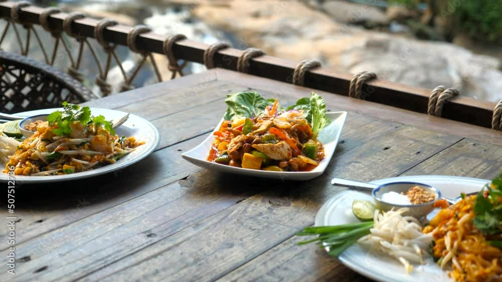 Thai traditional food in outdoor cafe. Shrimp Pad Thai, rice noodle ...