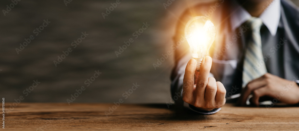 Standing man hold glowing light bulb, Creative new idea. Innovation ...