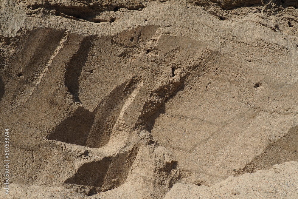 Sandstone is a fragmentary sedimentary rock, a homogeneous or layered ...