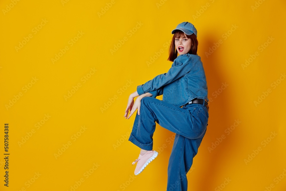 Pretty young female denim cap red lips glamor fashion studio model ...