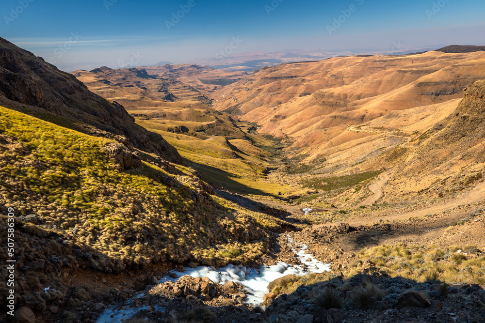 Mountain waterfall frozen at the Sani Pass, Drakensberg Mountains in ...